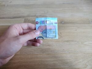 Magic trick with pen and dollar bill explained (with images)