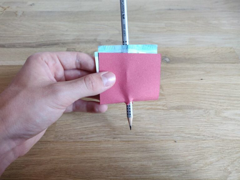 Magic trick with pen and dollar bill explained (with images)