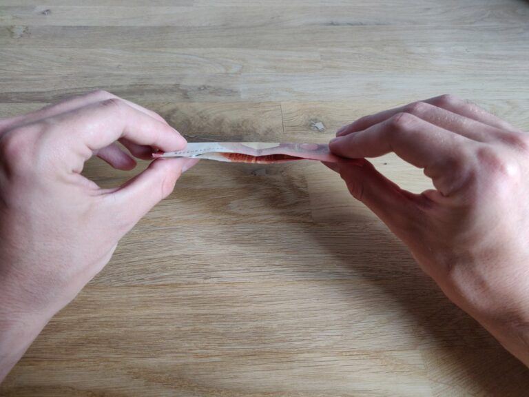 “Floating dollar bill” trick revealed: How to levitate money